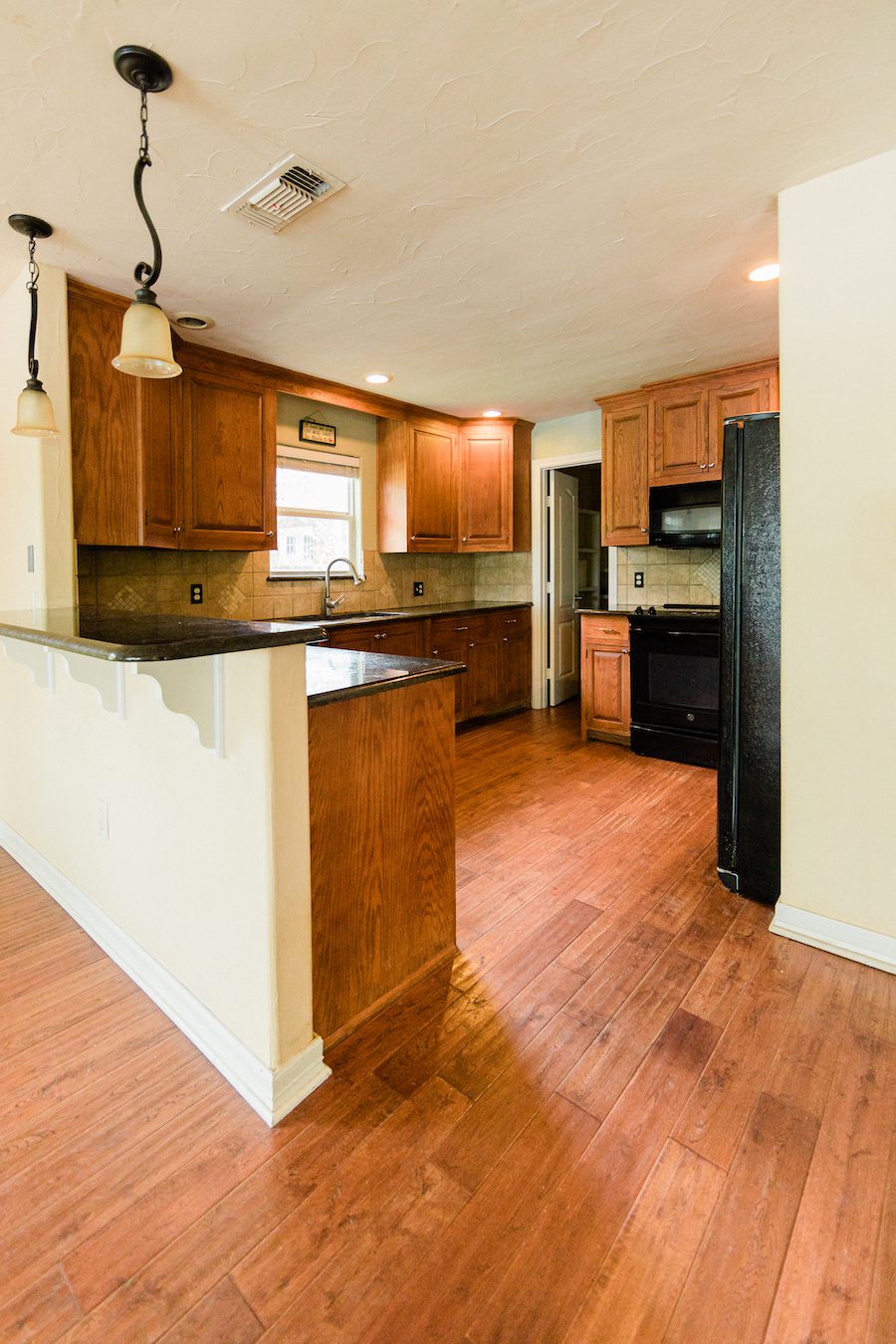 A Modern High Contrast Lake House Kitchen - The Interior Collective